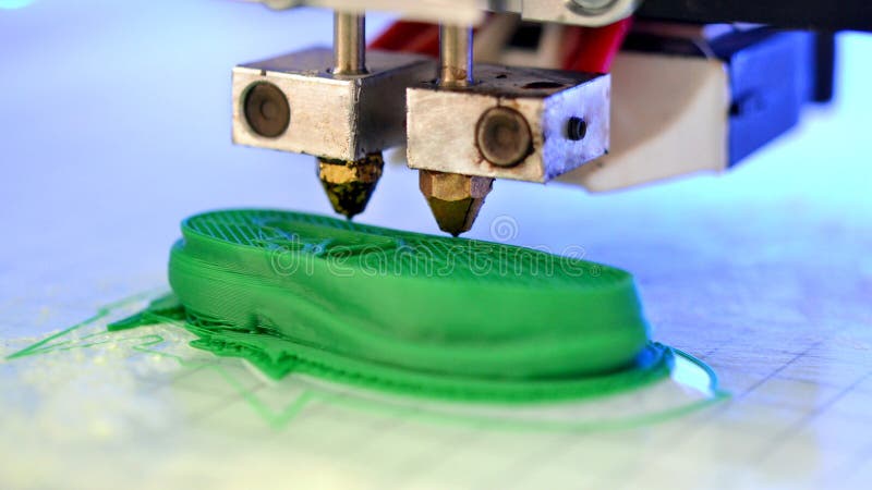 3D Printer Prints the Form of Molten Plastic Green. Stock Image - Image ...