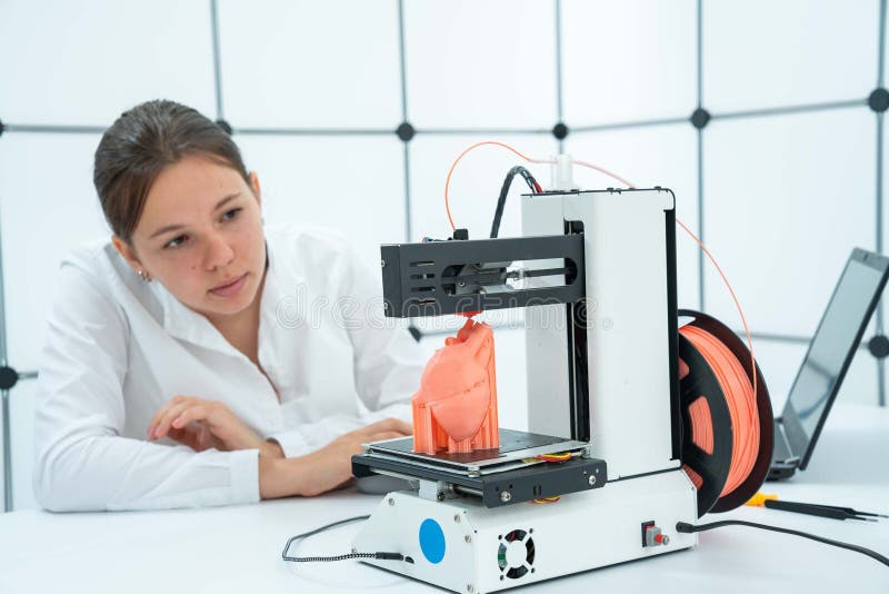 3D Printing of a Model of a Human Heart on a 3D Printer, a Young Female ...