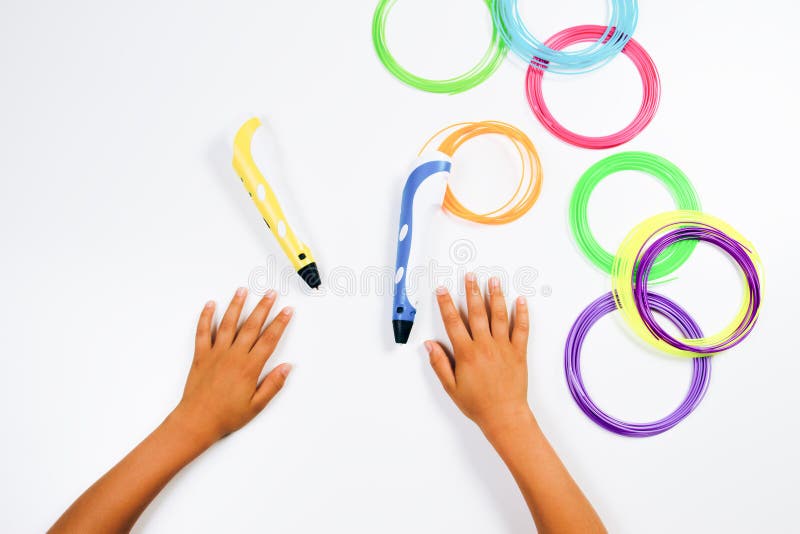 3d Printing Pens with Filaments and Kids Hands. Top View Stock Image ...