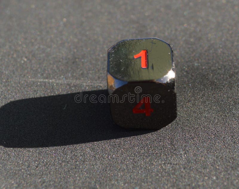 D6 Six-sided Black Metallic Die Dice on Foam Background in Bright ...