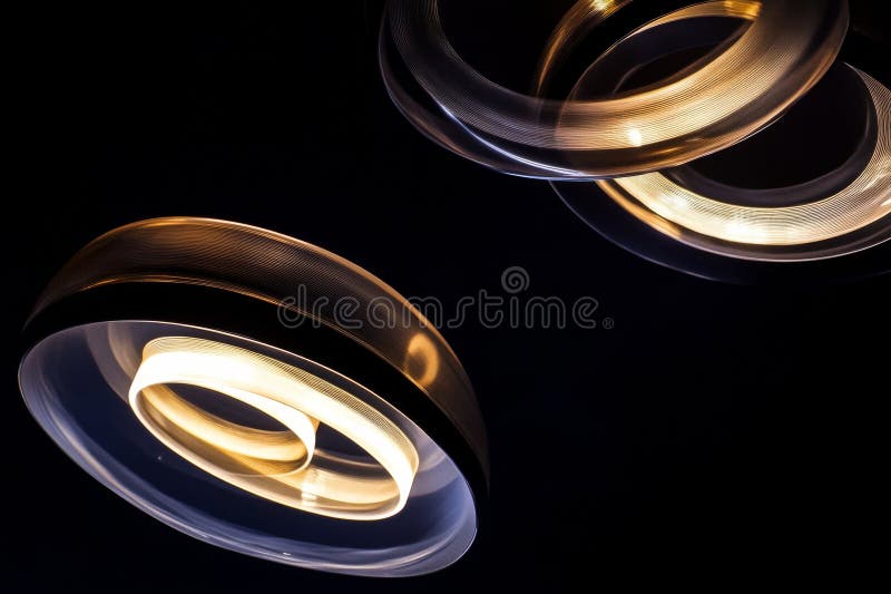 A 3D Wallpaper Featuring Illuminated Rings Floating and Rotating in ...