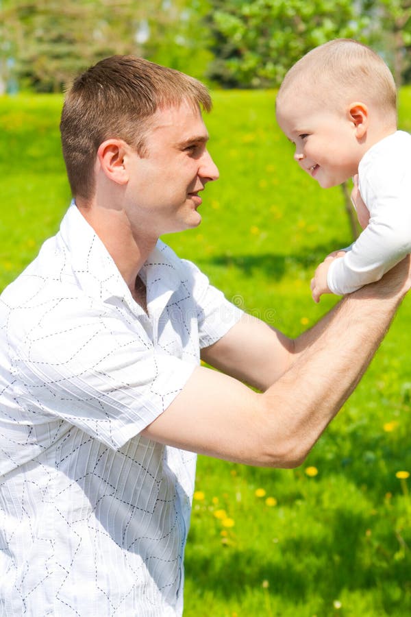 Dad and baby boy outdoors stock image. Image of happiness - 25000969