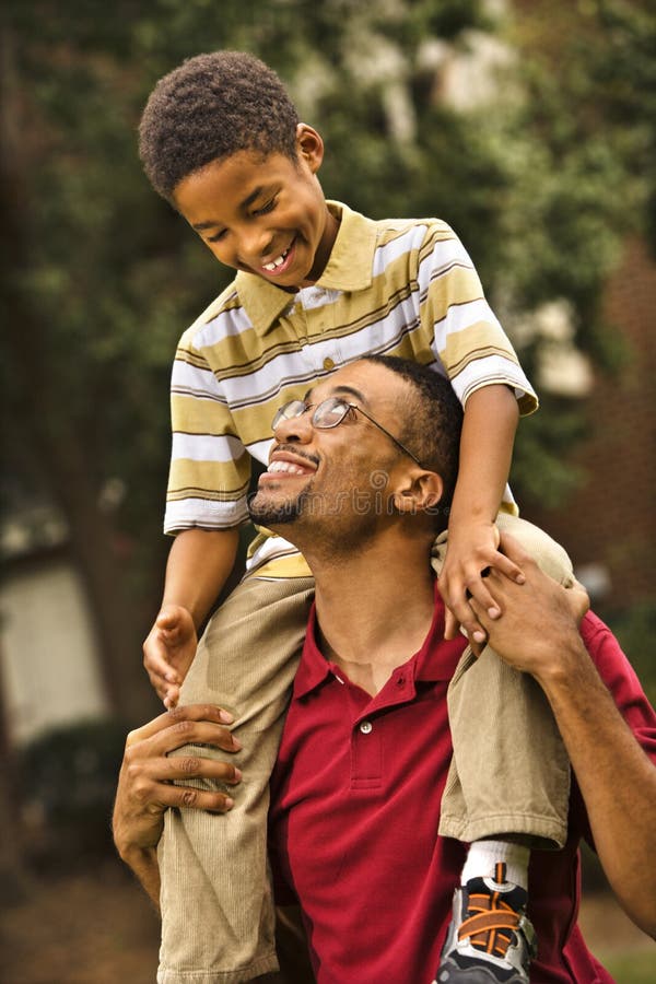 Dad carrying son stock image. Image of father, family - 4415037