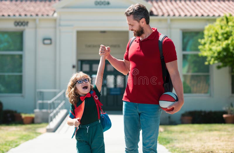Dad and Child Go Hand in Hand. Beginning of Lessons. Stock Photo ...