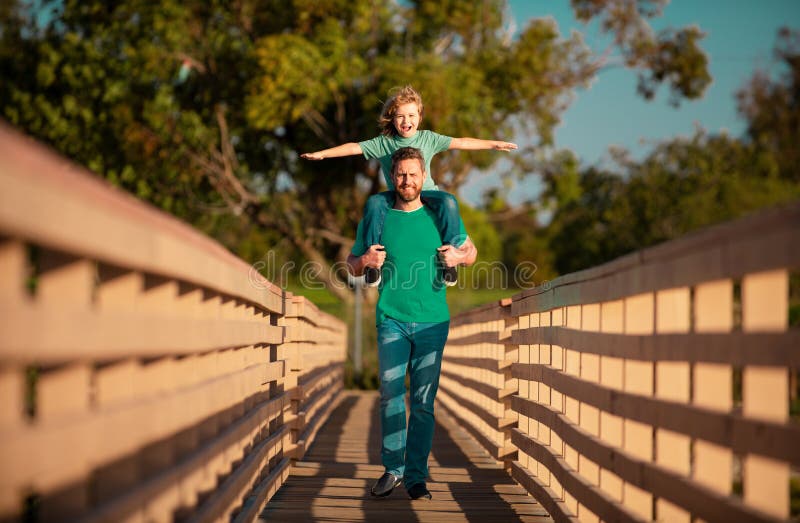 Dad and Child Having Fun Outdoors. Father Giving Son Ride on Back in ...
