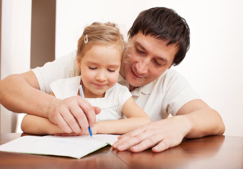 Dad with child writing stock photo. Image of pencil, parents - 50854698