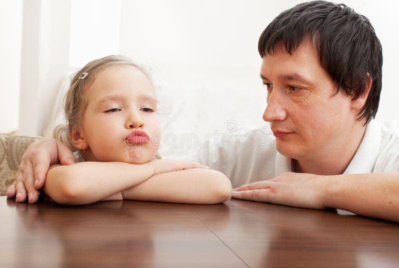 Dad comforts a sad girl stock photo. Image of little - 28087296