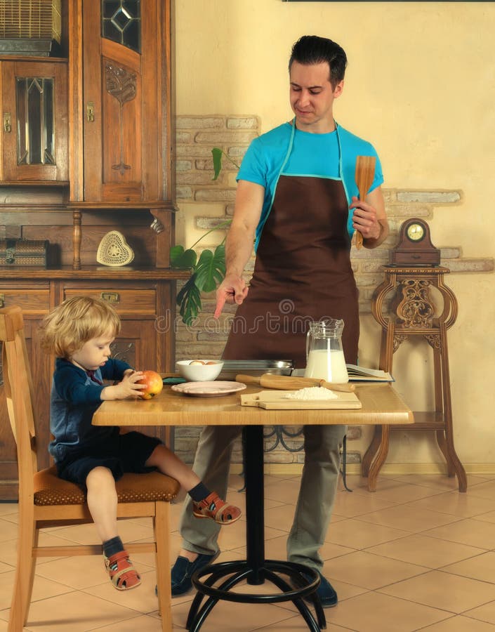 Dad cooks a breakfast stock image. Image of home, cooking - 55607987