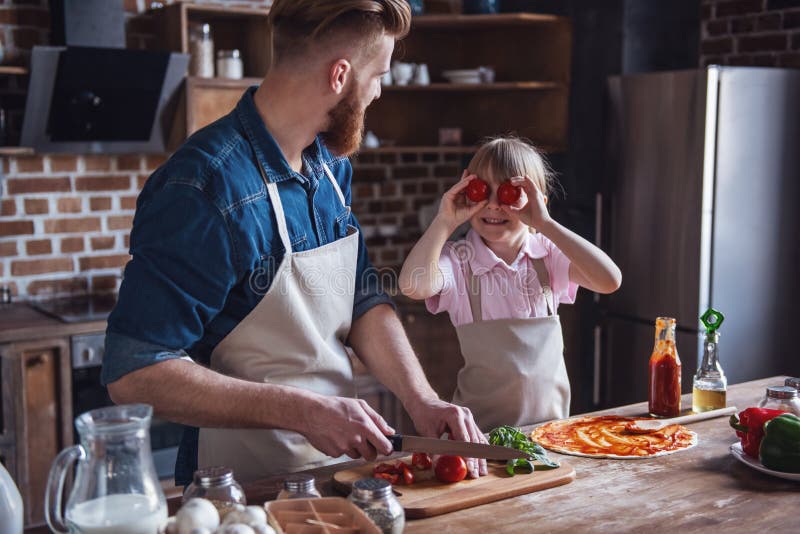 Dad and daughter cooking stock image. Image of communicate - 295606911