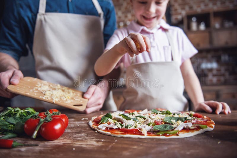 Dad and daughter cooking stock image. Image of leisure - 295607159