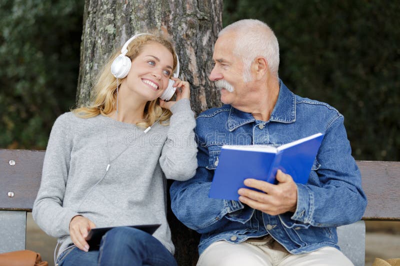 Dad and Daughter Having Fun in Park Stock Photo - Image of middle, aged ...