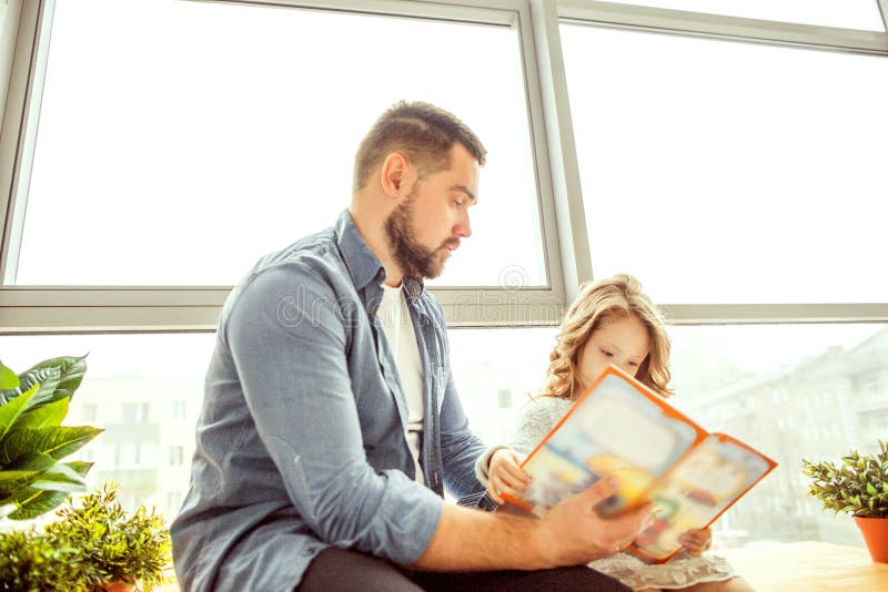 Dad and Daughter Reading a Book at Home Stock Photo - Image of fathers ...