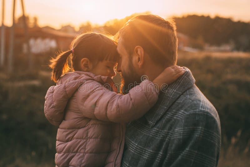 Dad and Daughter at Sunset on a Warm Autumn Day, Beautiful Light and ...
