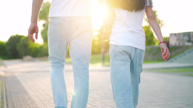 Dad and Daughter Walk Around Their Area at Sunset. Back View. Slow ...