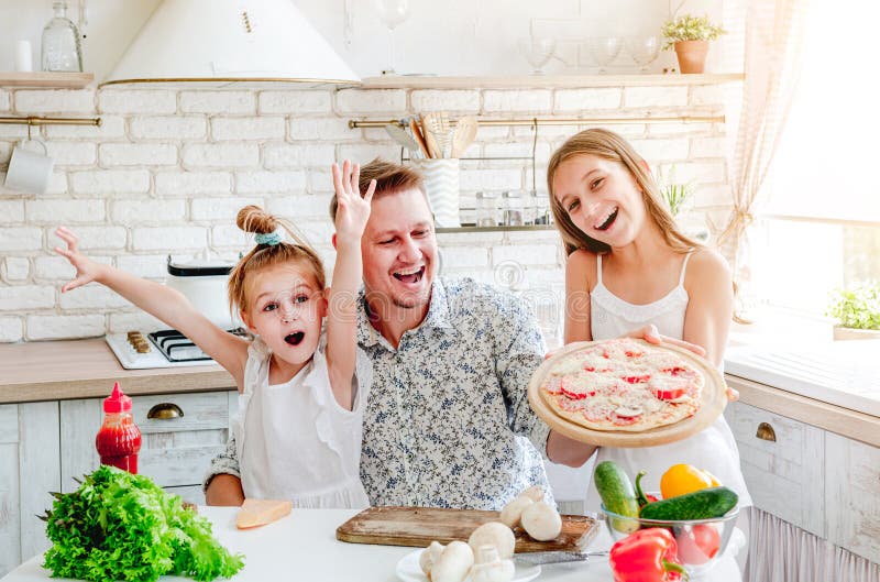 Dad with Daughters Preparing Pizza Stock Photo - Image of chef, cooking ...