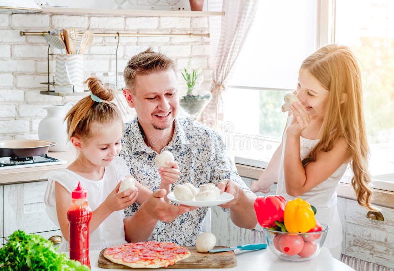 Dad with Daughters Preparing Pizza Stock Photo - Image of female ...
