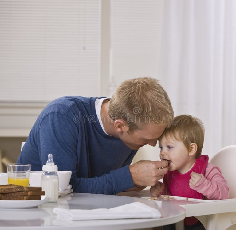 Dad Feeding Daughter Breakfast Stock Photo - Image of caucasian ...