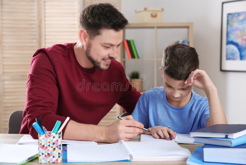 Dad Helping His Son with Homework Stock Photo - Image of adult, help ...
