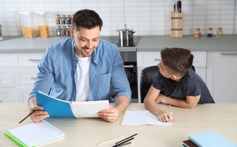Dad Helping His Son with Homework Stock Image - Image of portrait ...