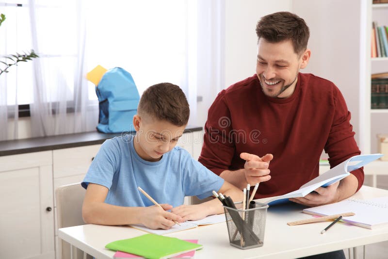 Dad Helping His Son with Homework Stock Photo - Image of exercise, room ...