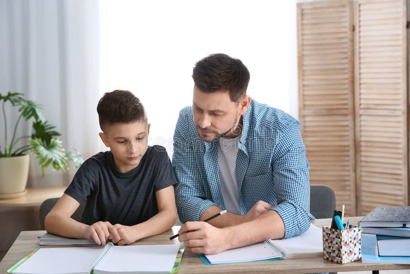 Dad Helping His Son with Homework Stock Image - Image of learn, mature ...