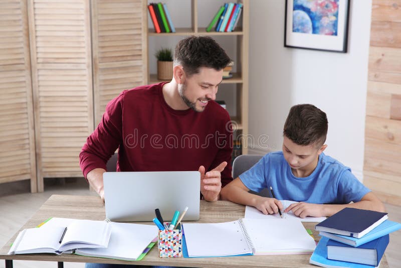Dad Helping His Son with Homework Stock Photo - Image of exercise ...
