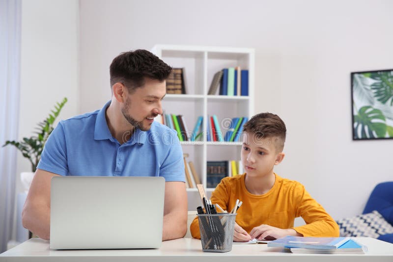 Dad Helping His Son with Homework Stock Image - Image of learn, help ...