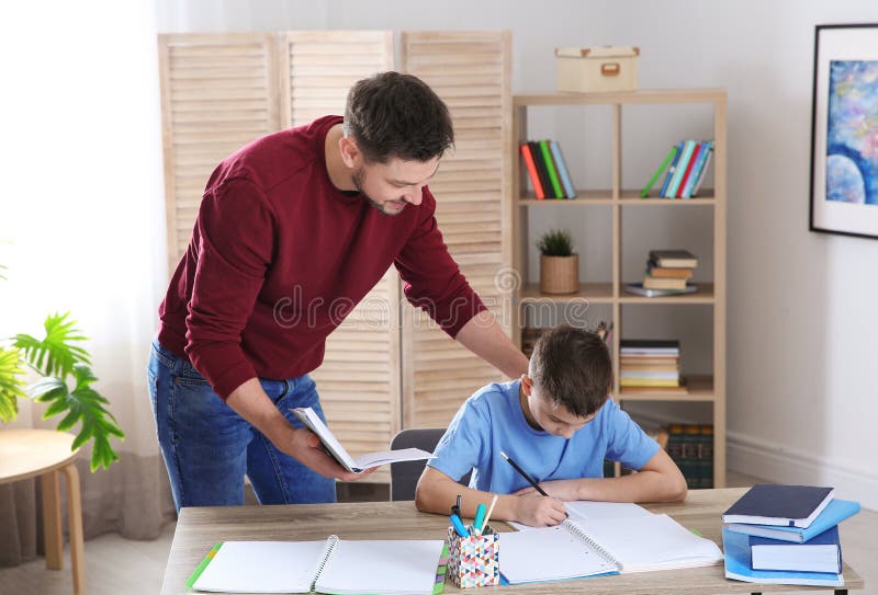 Dad Helping His Son with Homework Stock Photo - Image of learn ...