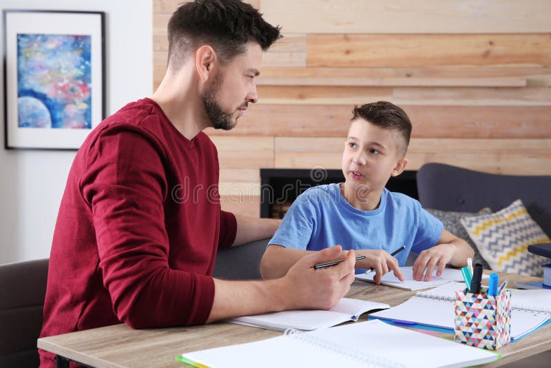 Dad Helping His Son with Homework Stock Image - Image of child, family ...
