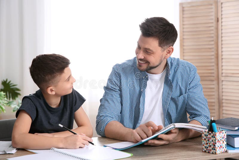 Dad Helping His Son with Homework Stock Image - Image of indoors, learn ...