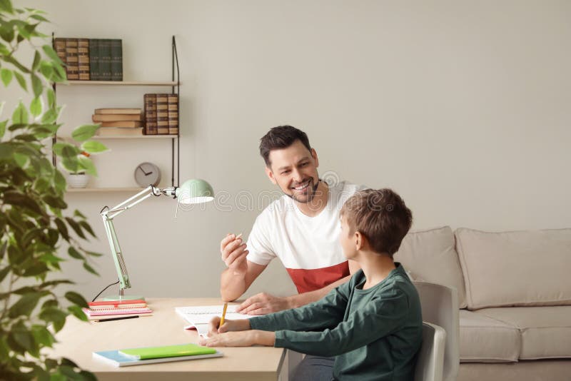 Dad Helping His Son with School Assignment Stock Image - Image of happy ...