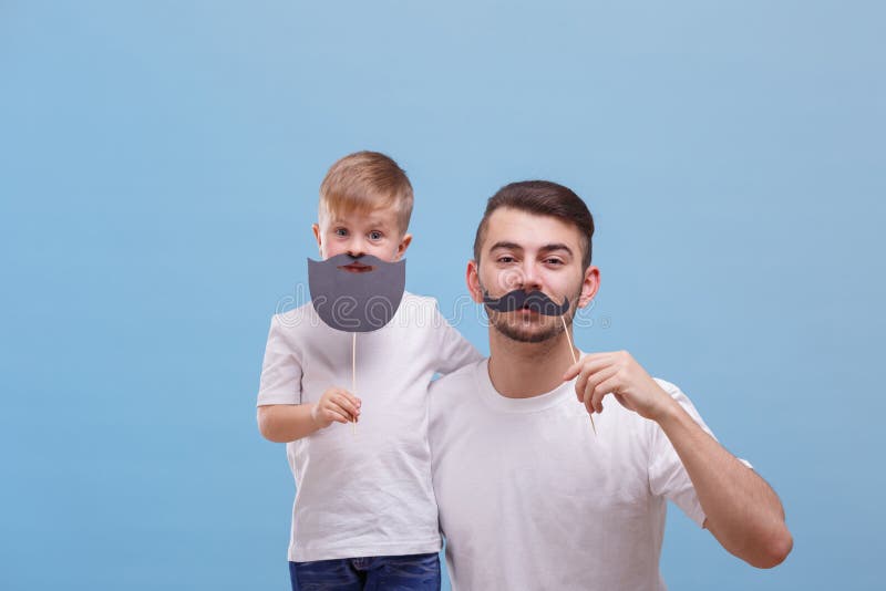 Dad and His Son Waving Hello on a Blue Background Stock Photo - Image ...