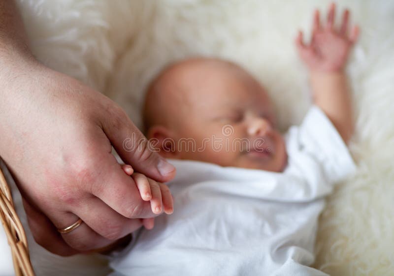 Dad Keeping Carefully Sleeping Newborn Baby Hand Stock Photo - Image of ...