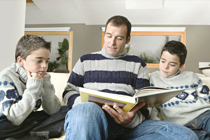 Dad and kids reading book stock photo. Image of hispanic - 28941110