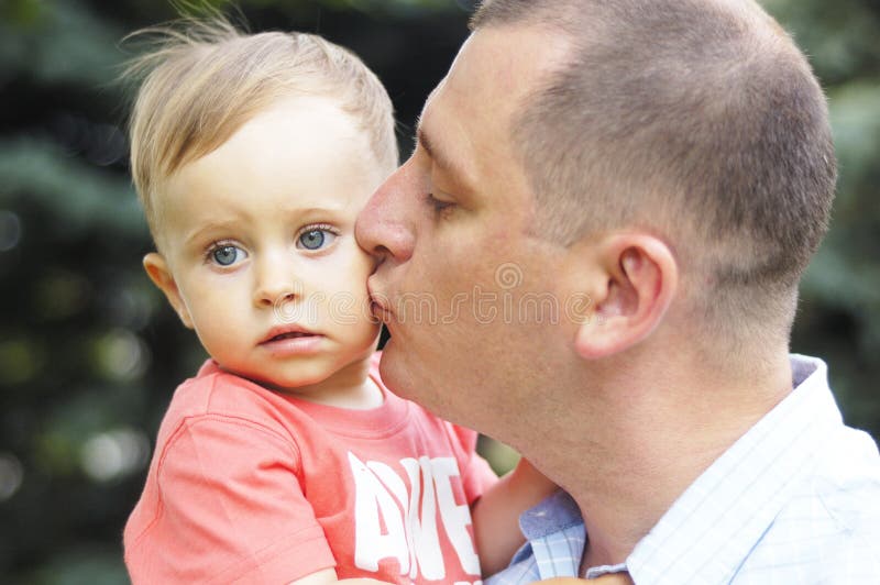 Father Kissing His Autistic Son Stock Photo - Image of outdoors ...