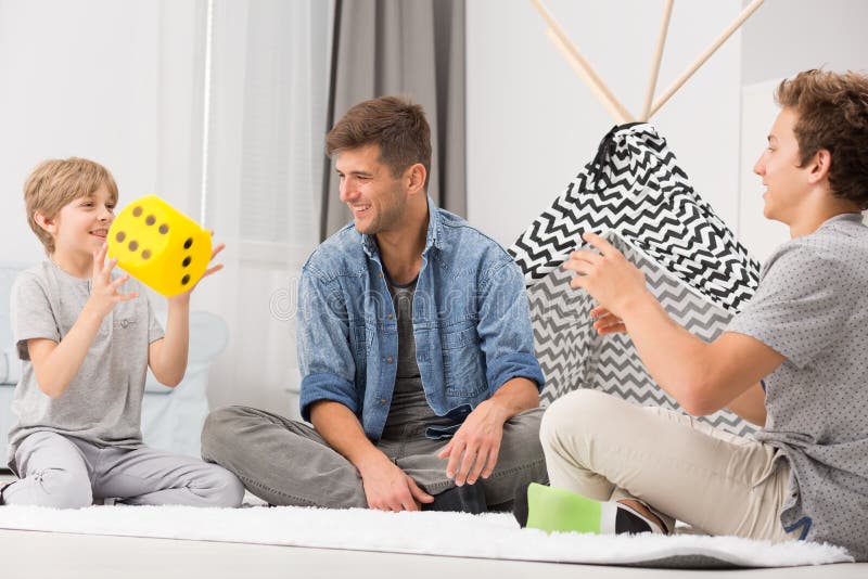 Dad playing with sons stock image. Image of happy, indoors - 83821773 Dad playing with sons stock image. Image of happy, indoors - 83821773