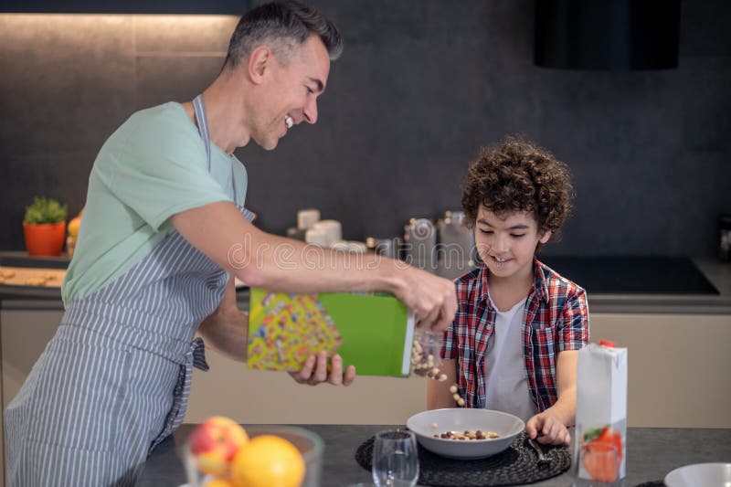 Dad Preparing Breakfast for His Son in the Kitchen Stock Image - Image ...