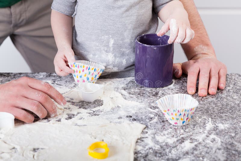 Dad and son baking cookies stock image. Image of parenting - 39647047
