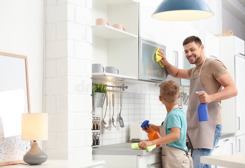 Dad and Son Cleaning in Kitchen Stock Photo - Image of happy, family ...