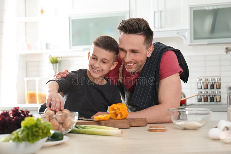 Dad and Son Cooking Together Stock Image - Image of enjoy, food: 155786843