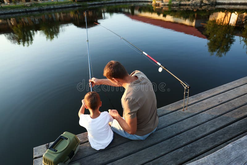 Dad and Son Fishing Together Stock Photo - Image of rest, spin: 157753734