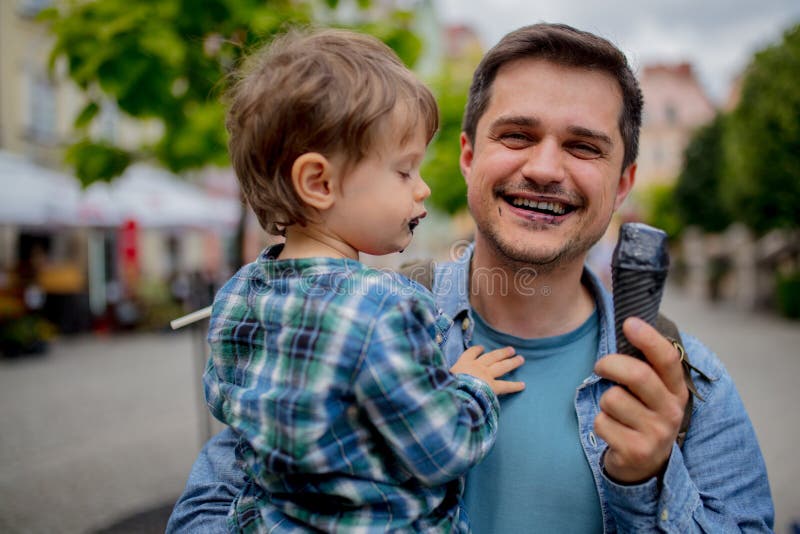 Dad and Son Have a Fun with Black Ice-cream Stock Image - Image of cool ...