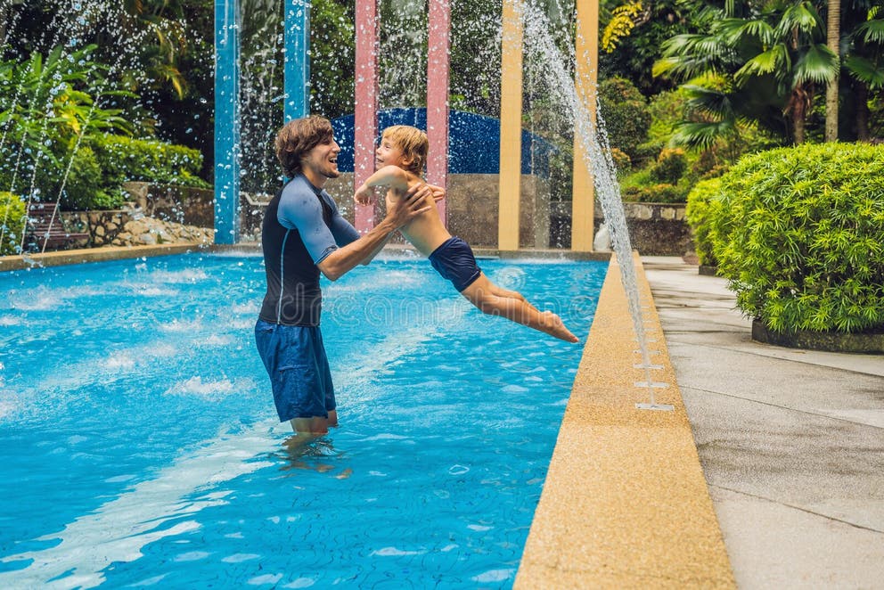 Dad and Son Have Fun in the Pool Stock Image - Image of activity, male ...