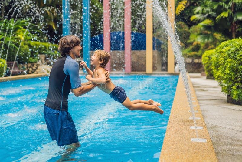 Dad and Son Have Fun in the Pool Stock Photo - Image of resort ...