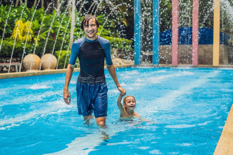 Dad and Son Have Fun in the Pool Stock Image - Image of children, smile ...