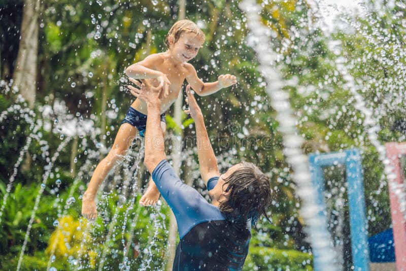 Dad and Son Have Fun in the Pool Stock Photo - Image of children, jump ...