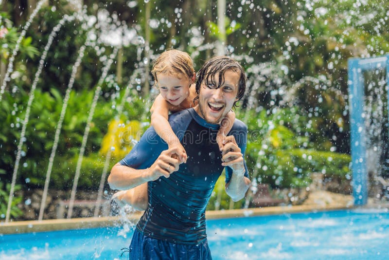 Dad and Son Have Fun in the Pool Stock Image - Image of life, outside ...