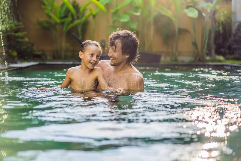 Dad and Son Have Fun in the Pool Stock Photo - Image of baby, holiday ...
