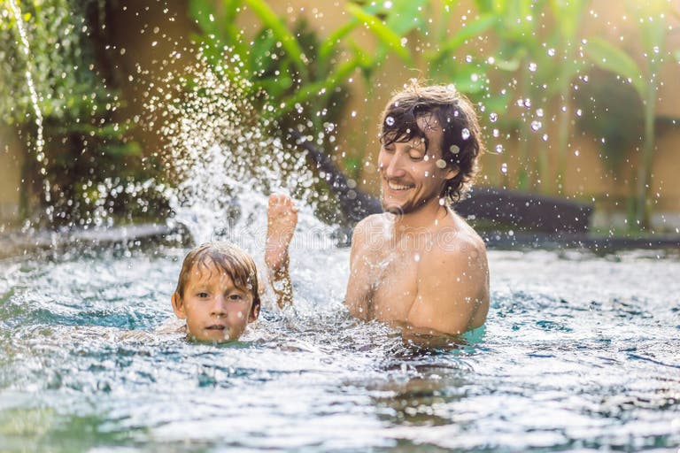 Dad and Son Have Fun in the Pool Stock Image - Image of resort, healthy ...