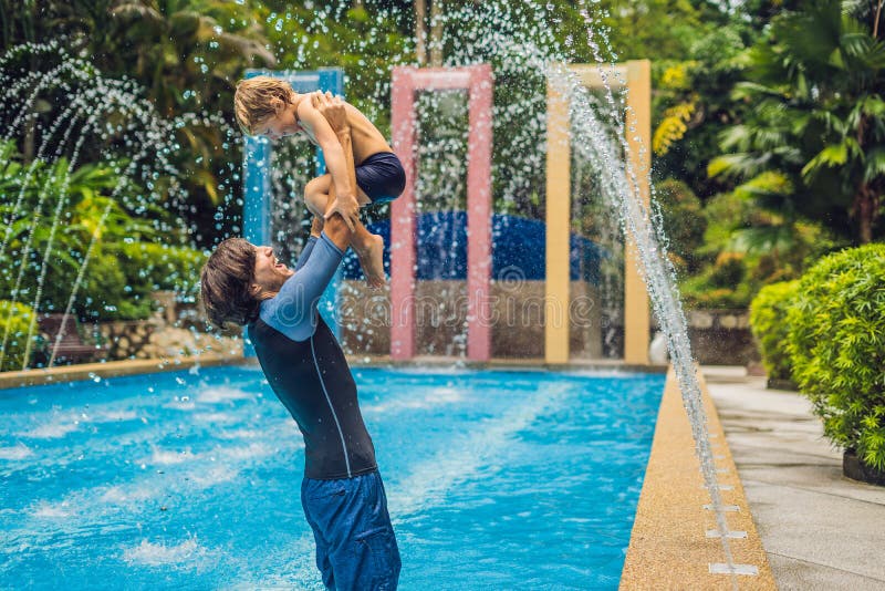 Dad and Son Have Fun in the Pool Stock Photo - Image of happiness ...